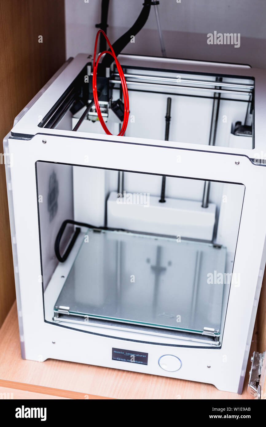 3d printer with bright red filament Stock Photo - Alamy