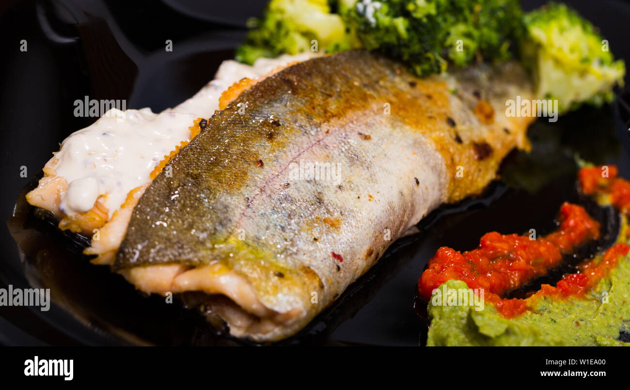 Healthy lunch - grilled fillets of trout served with boiled broccoli ...