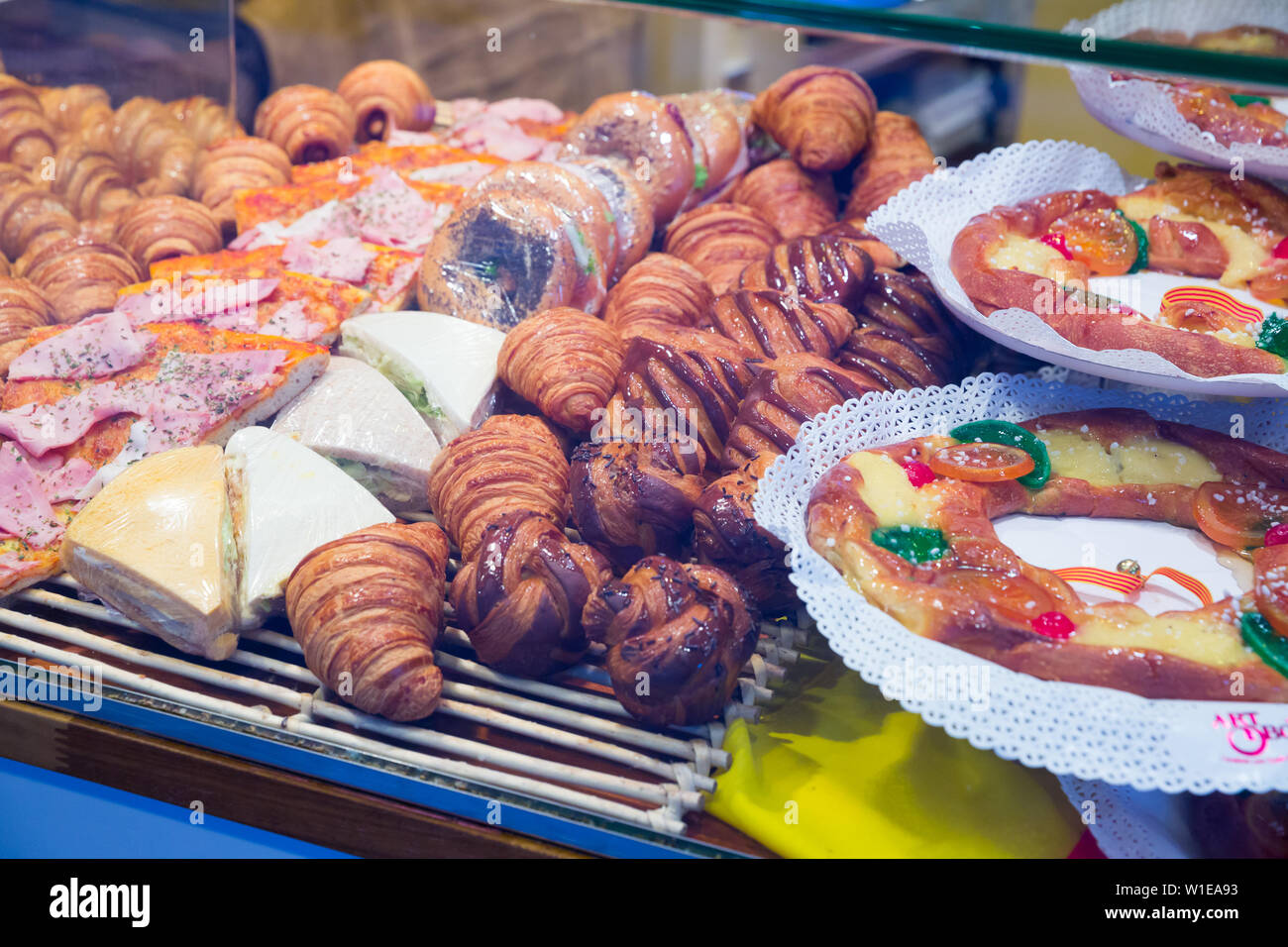Traditional appetizing french pastries display in European cake shop ...