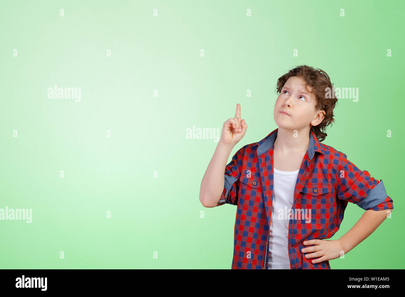cute young boy thinking Stock Photo - Alamy