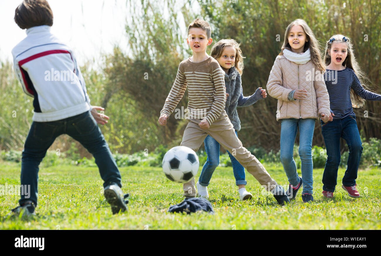 Children running after ball hi-res stock photography and images - Alamy