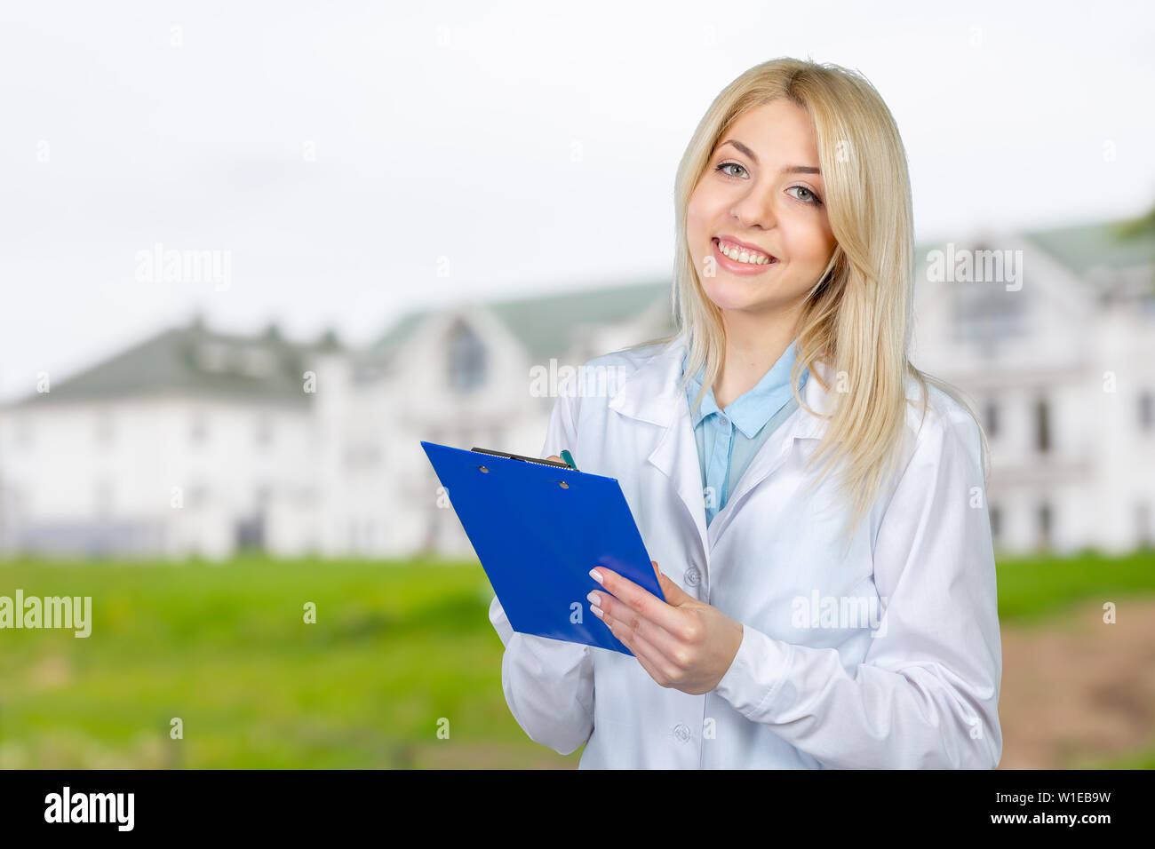 Woman doctor standing Stock Photo - Alamy