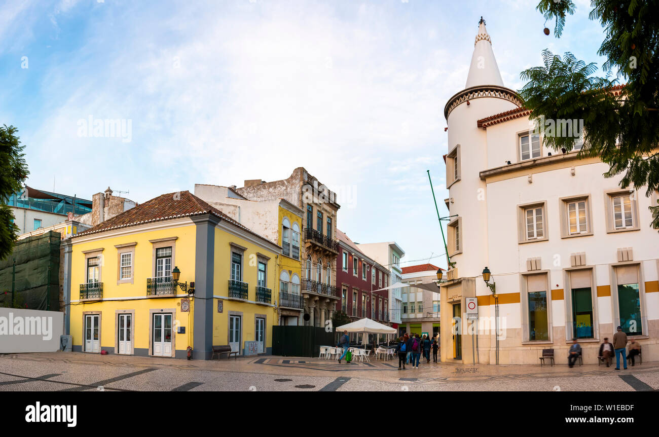 Tourist area downtown of Faro city with cobblestone streets and stores ...