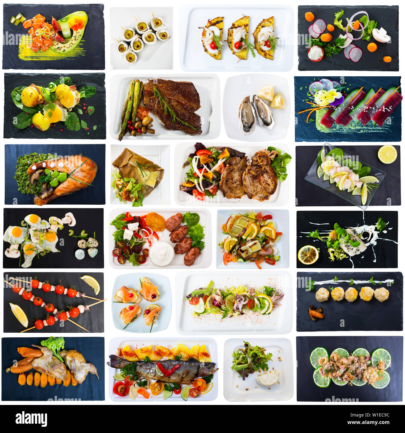 Set of various appetizing dishes served on square plates isolated on ...