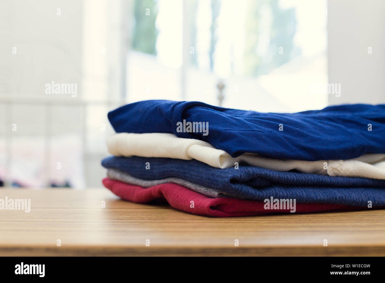 Stack of clothes Stock Photo - Alamy