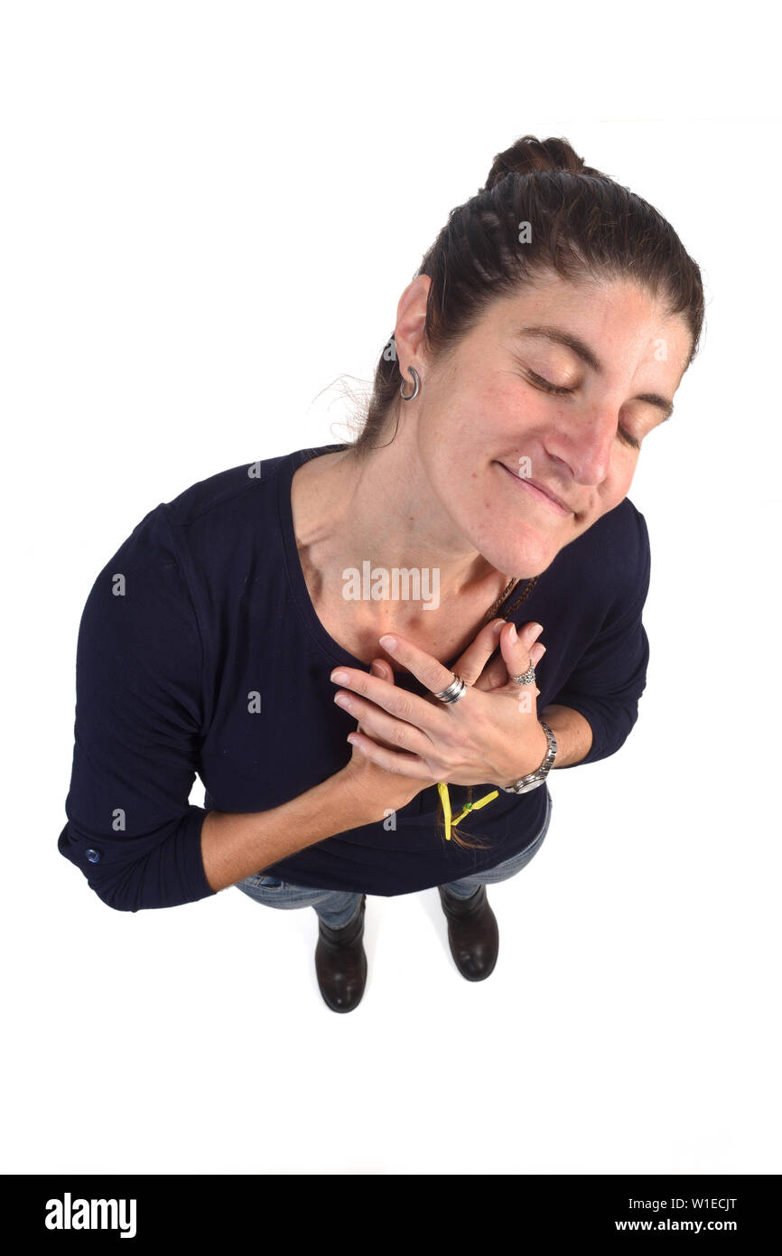Woman smiling hands on chest Cut Out Stock Images & Pictures - Alamy
