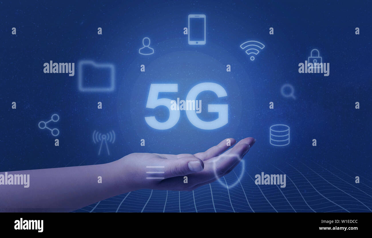 Mobile phone fifth generation concept. 5G in woman hand surrounded by ...