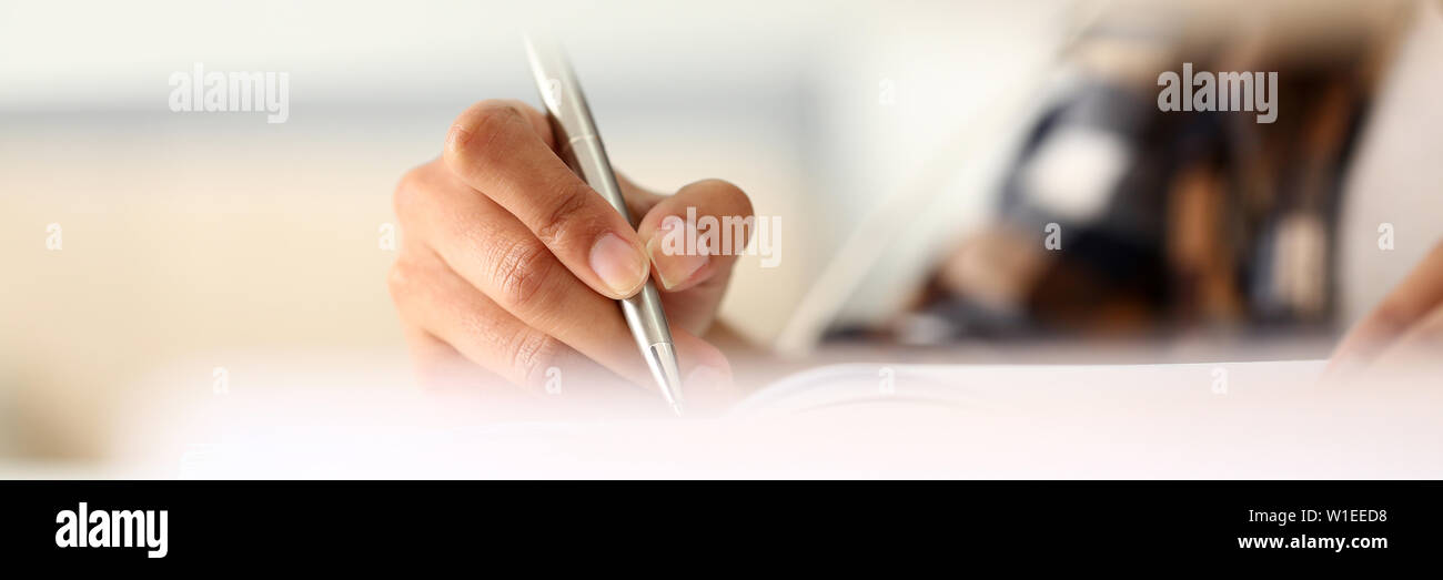 Arm of black woman write story in notebook Stock Photo - Alamy