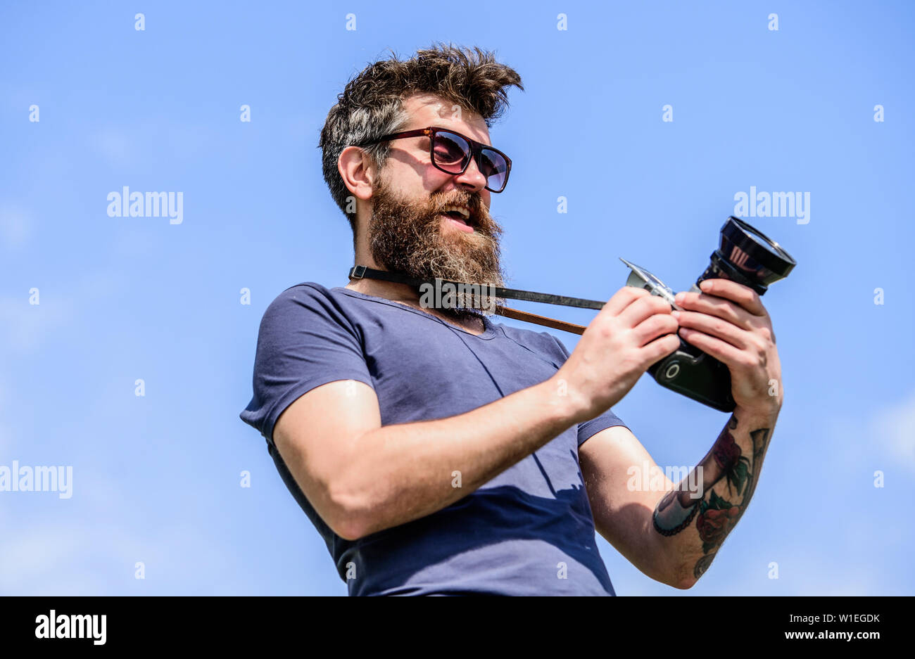 retro photographic equipment. hipster man in sunglasses. Mature hipster ...