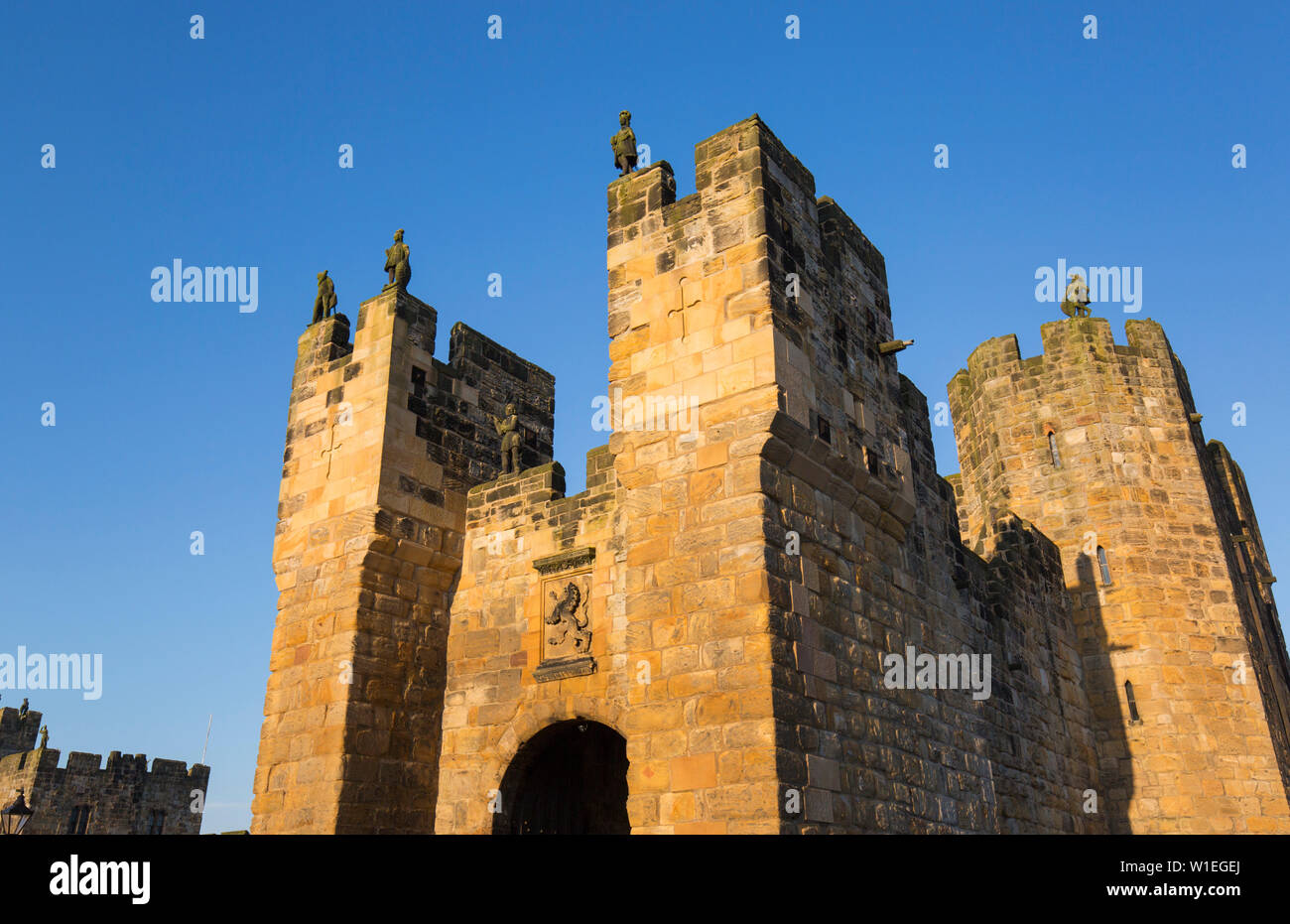 The medieval barbican and gatehouse of Alnwick Castle, sunset, Alnwick ...