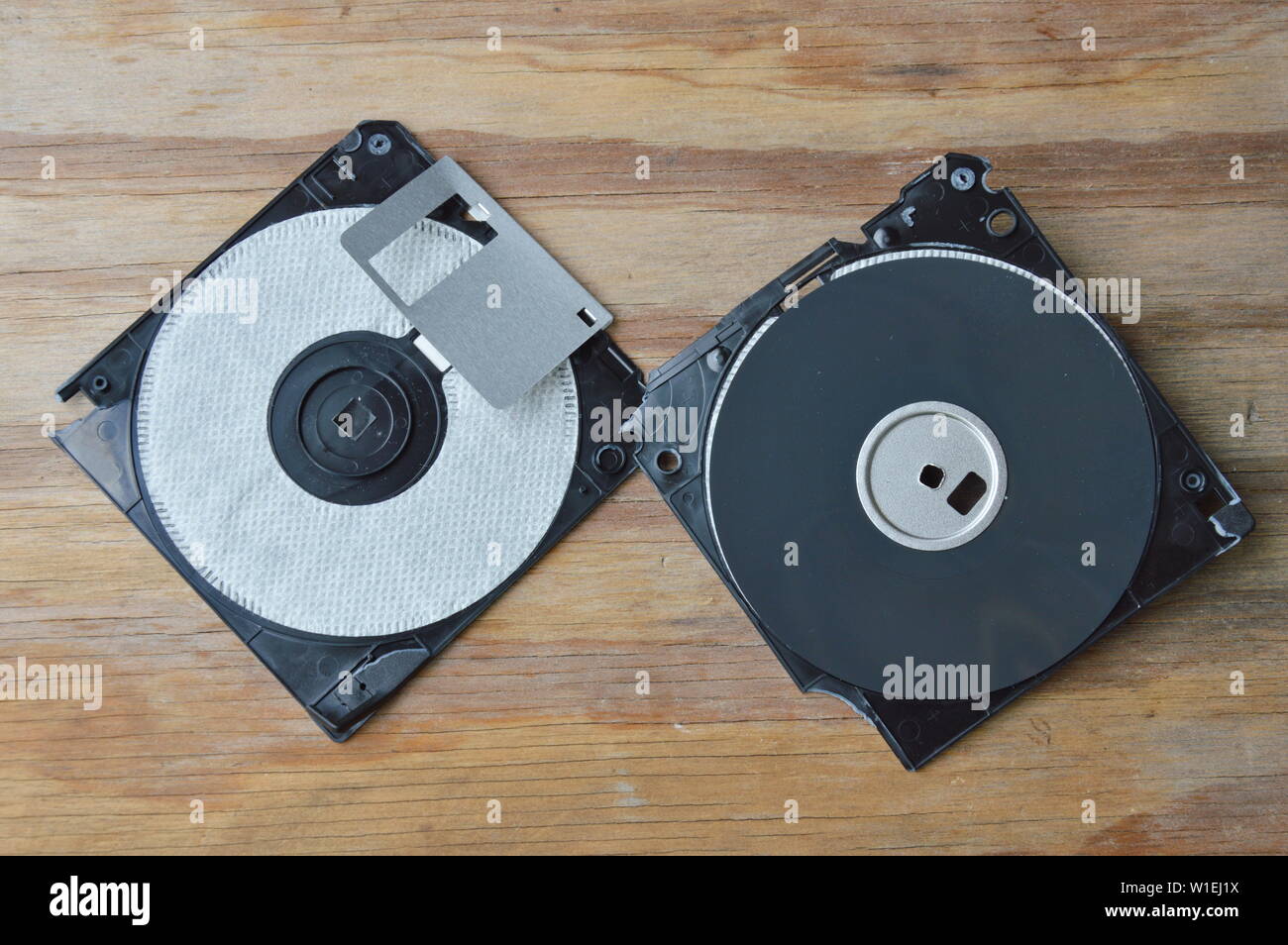 broken floppy disk on wooden board Stock Photo - Alamy