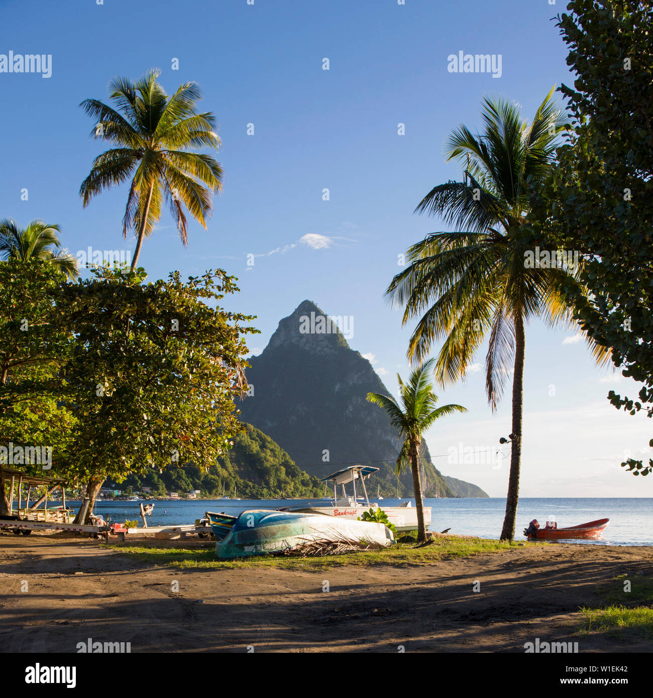 View from palm-fringed beach across Soufriere Bay to Petit Piton ...