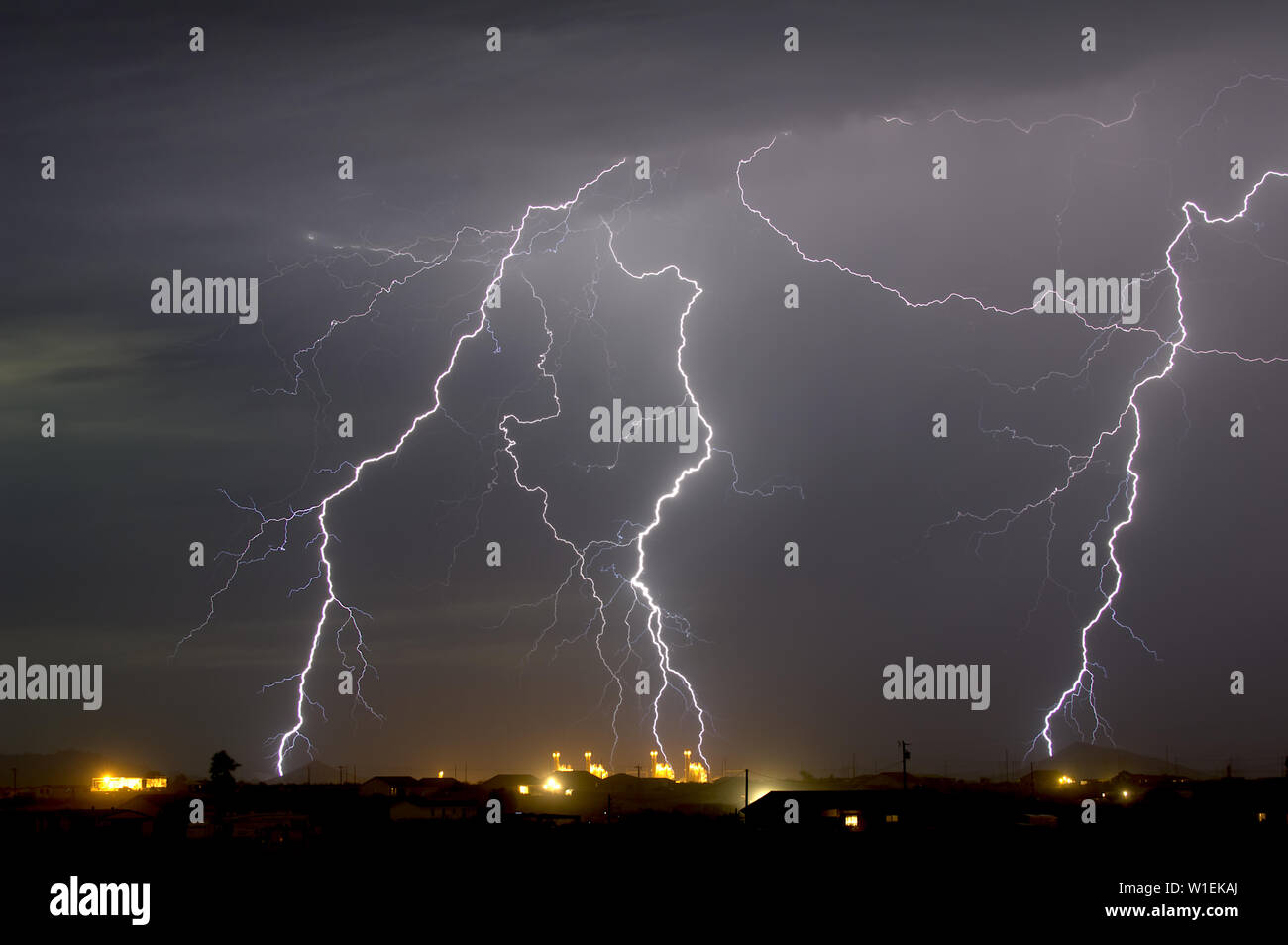 Multiple lightning bolts striking a power plant in Arlington during the ...