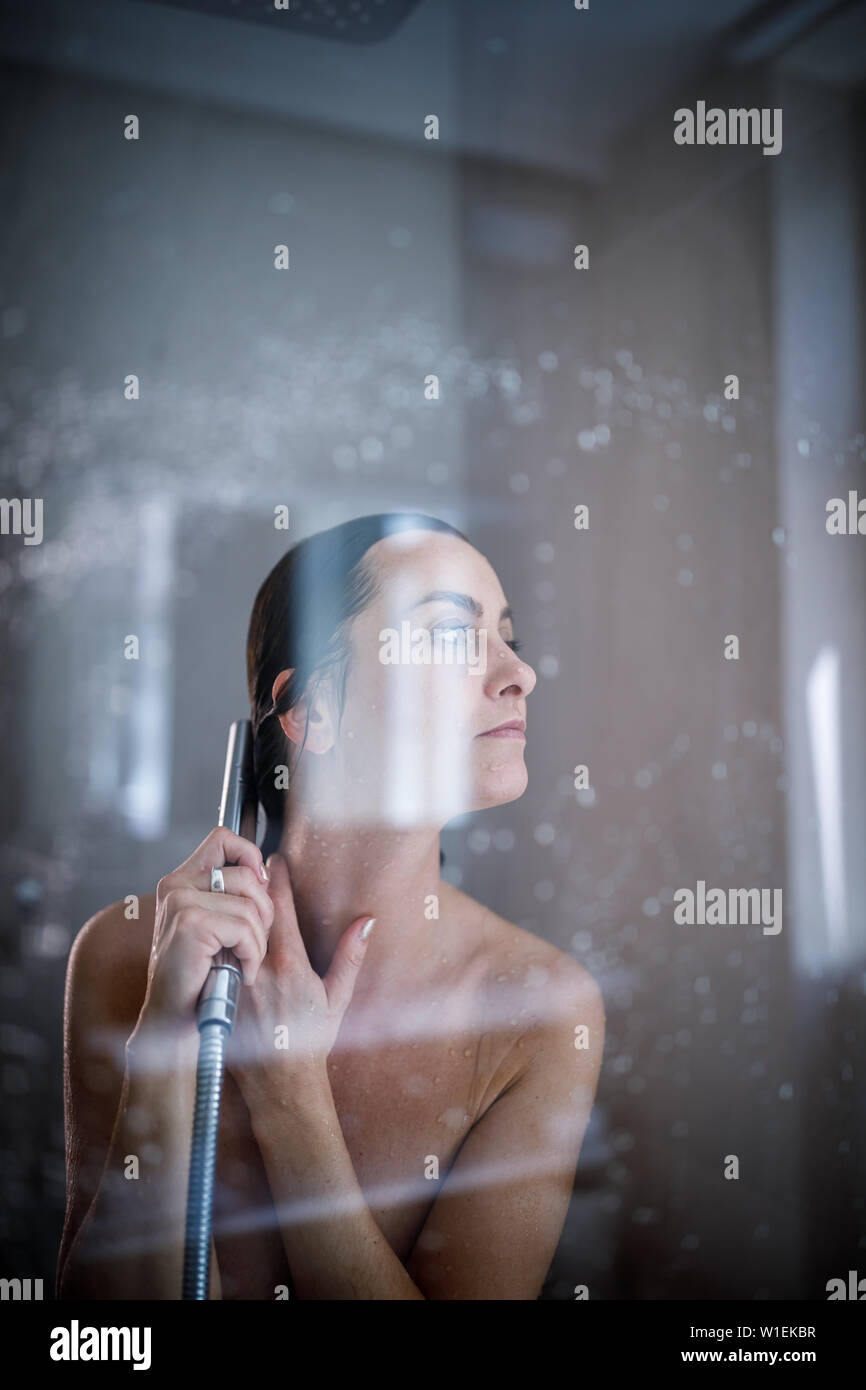 Woman Taking A Long Hot Shower Washing Her Hair In A Modern Design