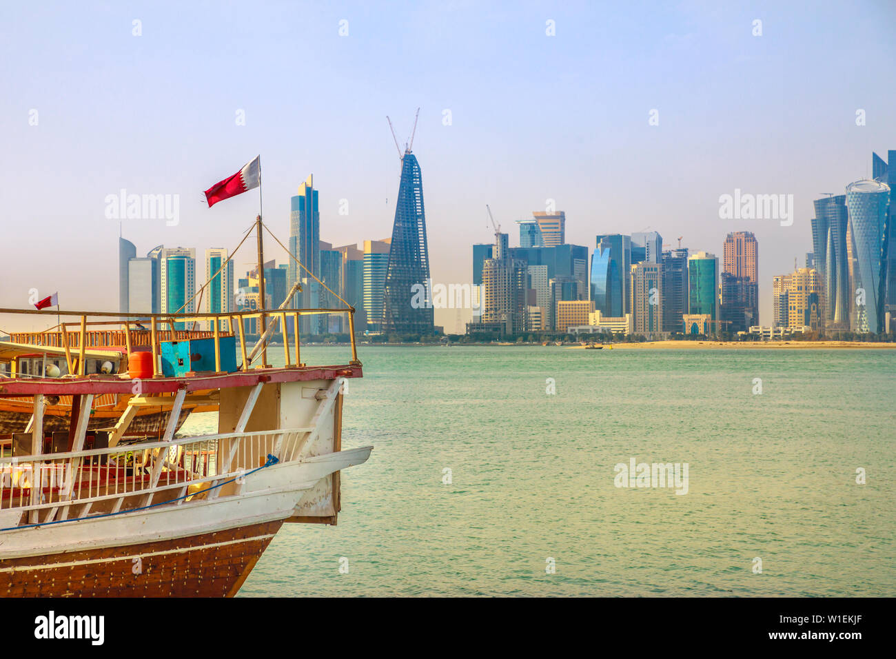 Close up of traditional wooden dhow with Qatari flag in Doha Bay in ...
