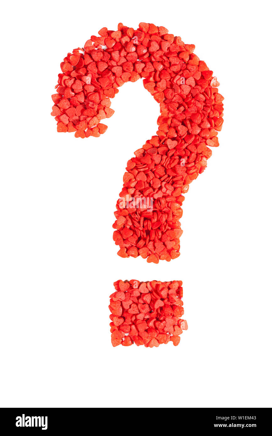 Question mark made of little red candies in shape of hearts on white ...