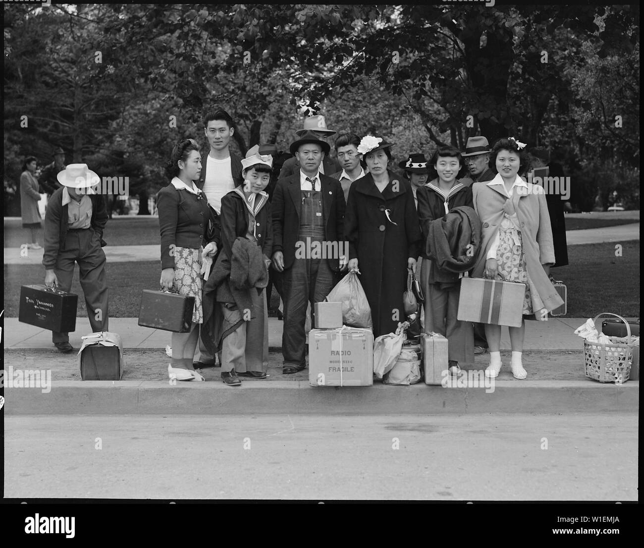 Hayward, California. This farm family await evacuation bus. Father and ...