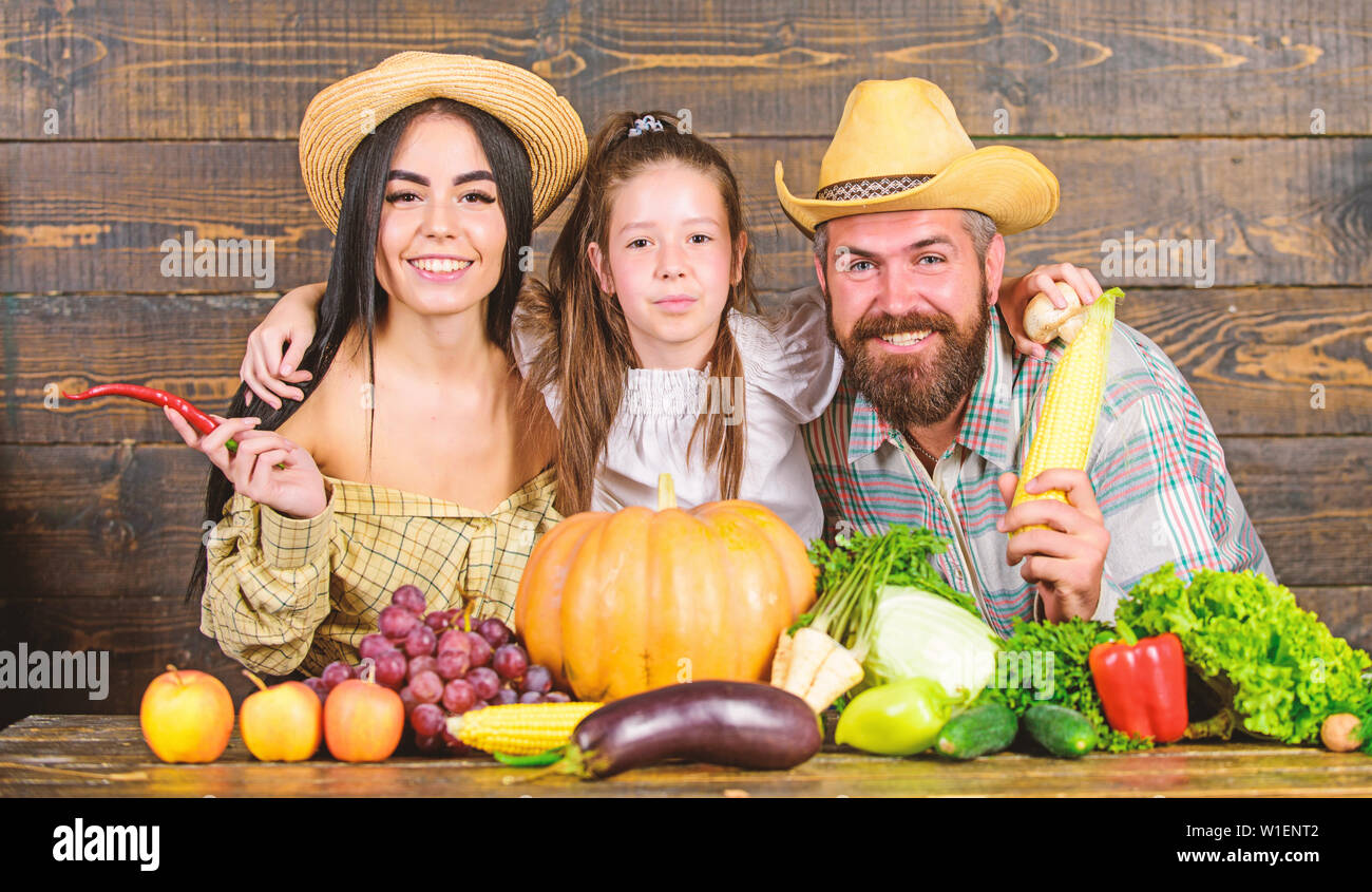 Family farmers with harvest wooden background. Family rustic style ...