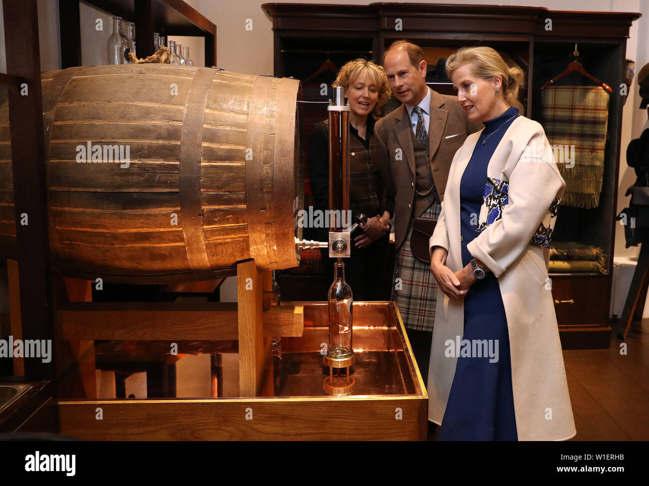 The Earl and Countess of Forfar pour a bottle of whisky ahead of ...