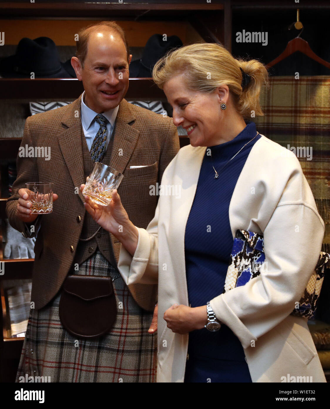 The Earl and Countess of Forfar pour a bottle of whisky ahead of ...