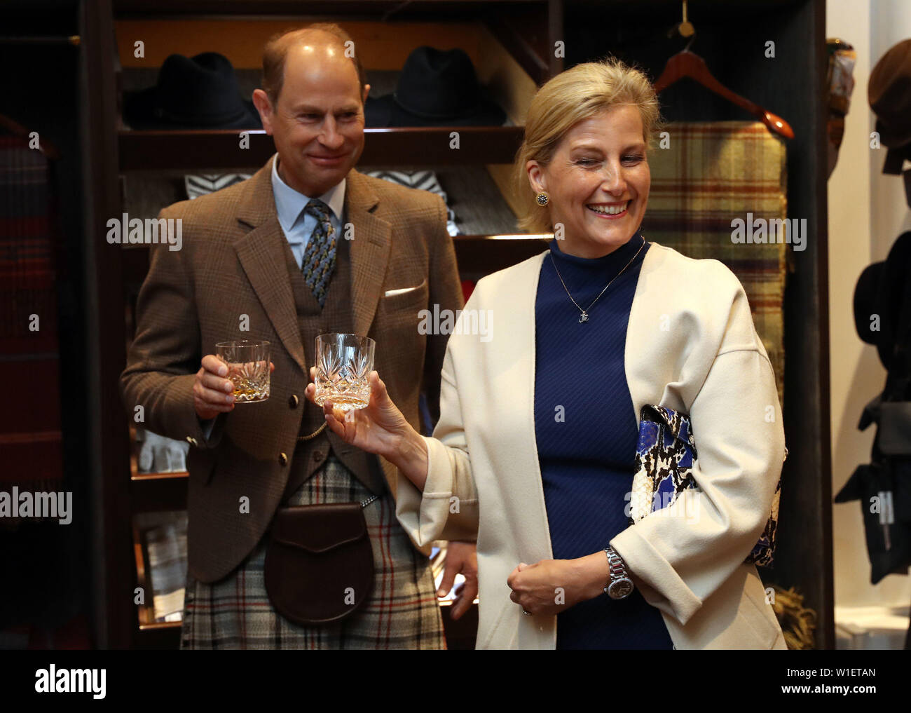 The Earl and Countess of Forfar pour a bottle of whisky ahead of ...