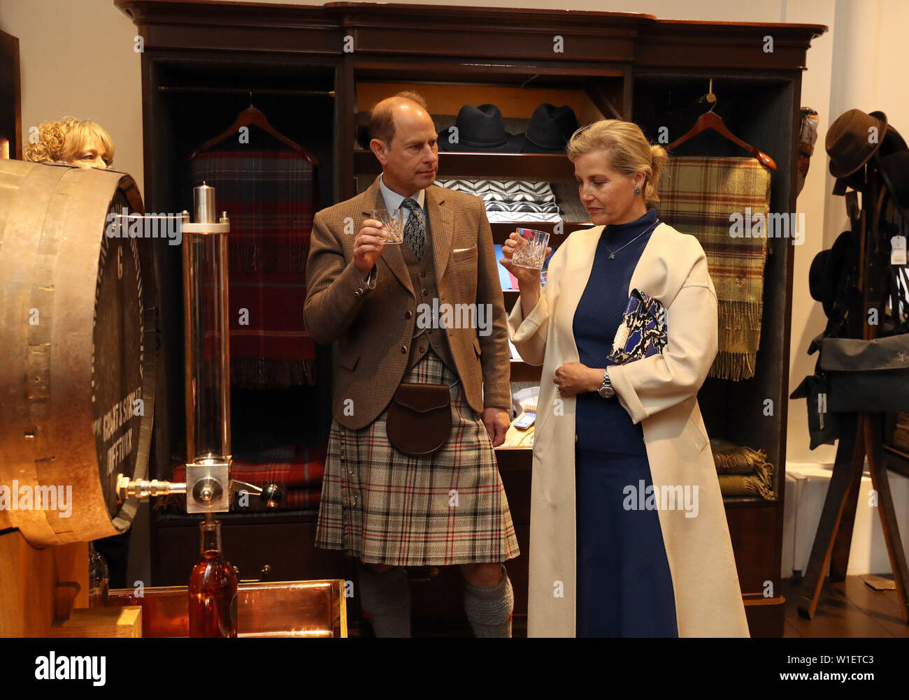 The Earl and Countess of Forfar pour a bottle of whisky ahead of ...