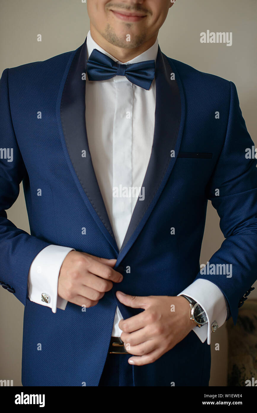 Attractive young Caucasian man smiling, a classy groom or a ...