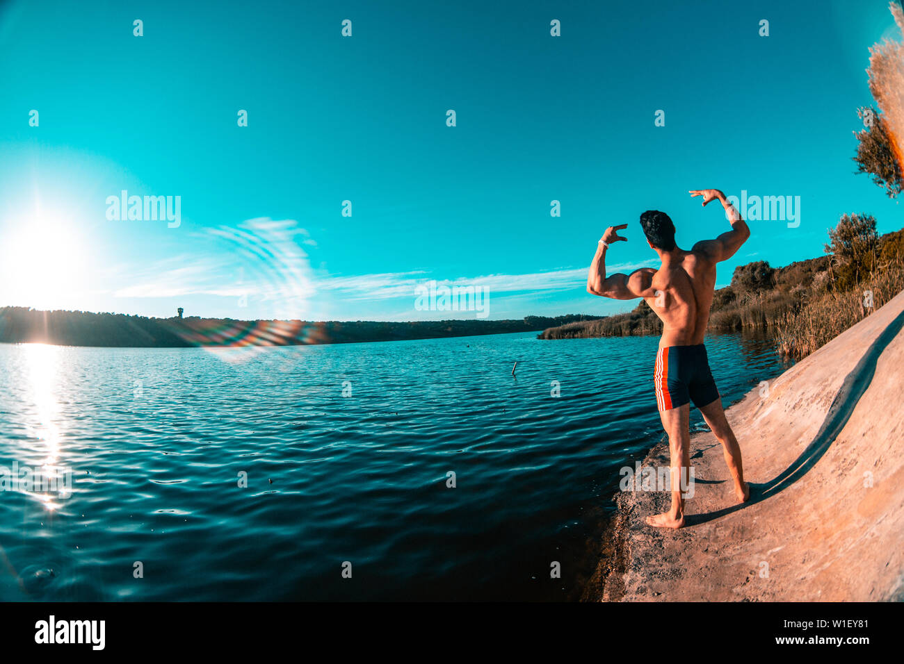 male model posing in nature , fit and bodybuilding model . crossfit ...