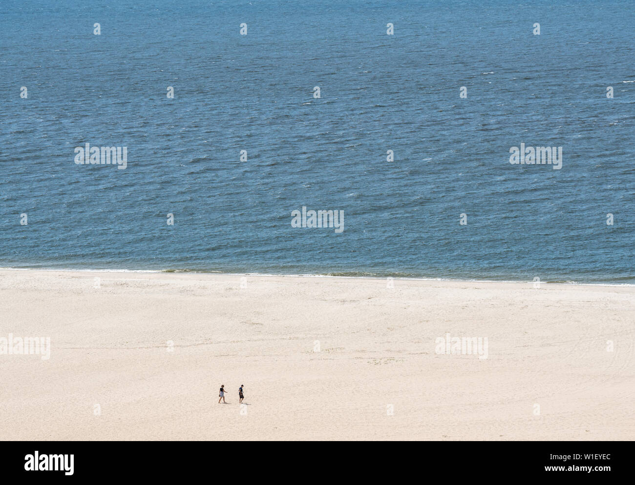 Single couple on wide beach at Cape May Point in New Jersey Stock Photo ...