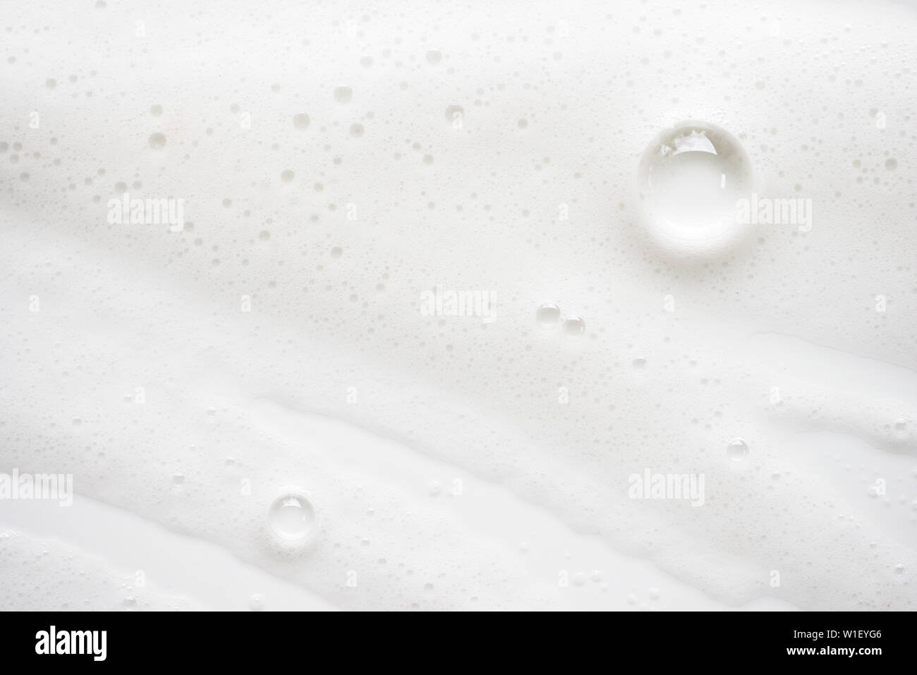 Abstract background white soapy foam texture. Shampoo foam with bubbles ...