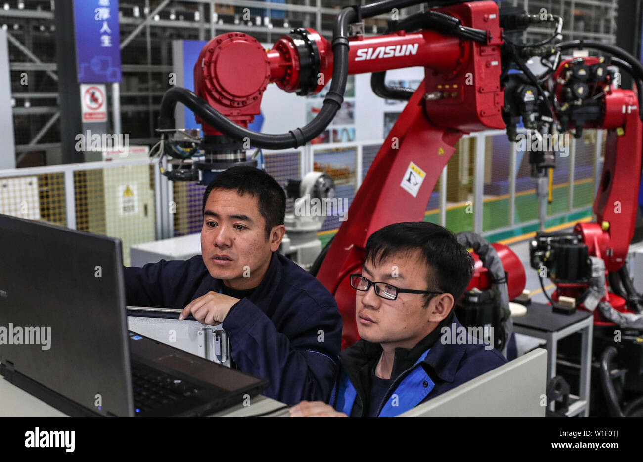 Beijing, China's Liaoning Province. 11th Mar, 2019. Engineers work at ...