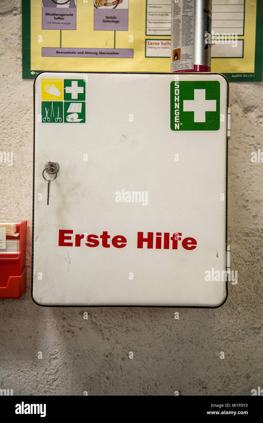 First aid kit on factory wall Stock Photo - Alamy