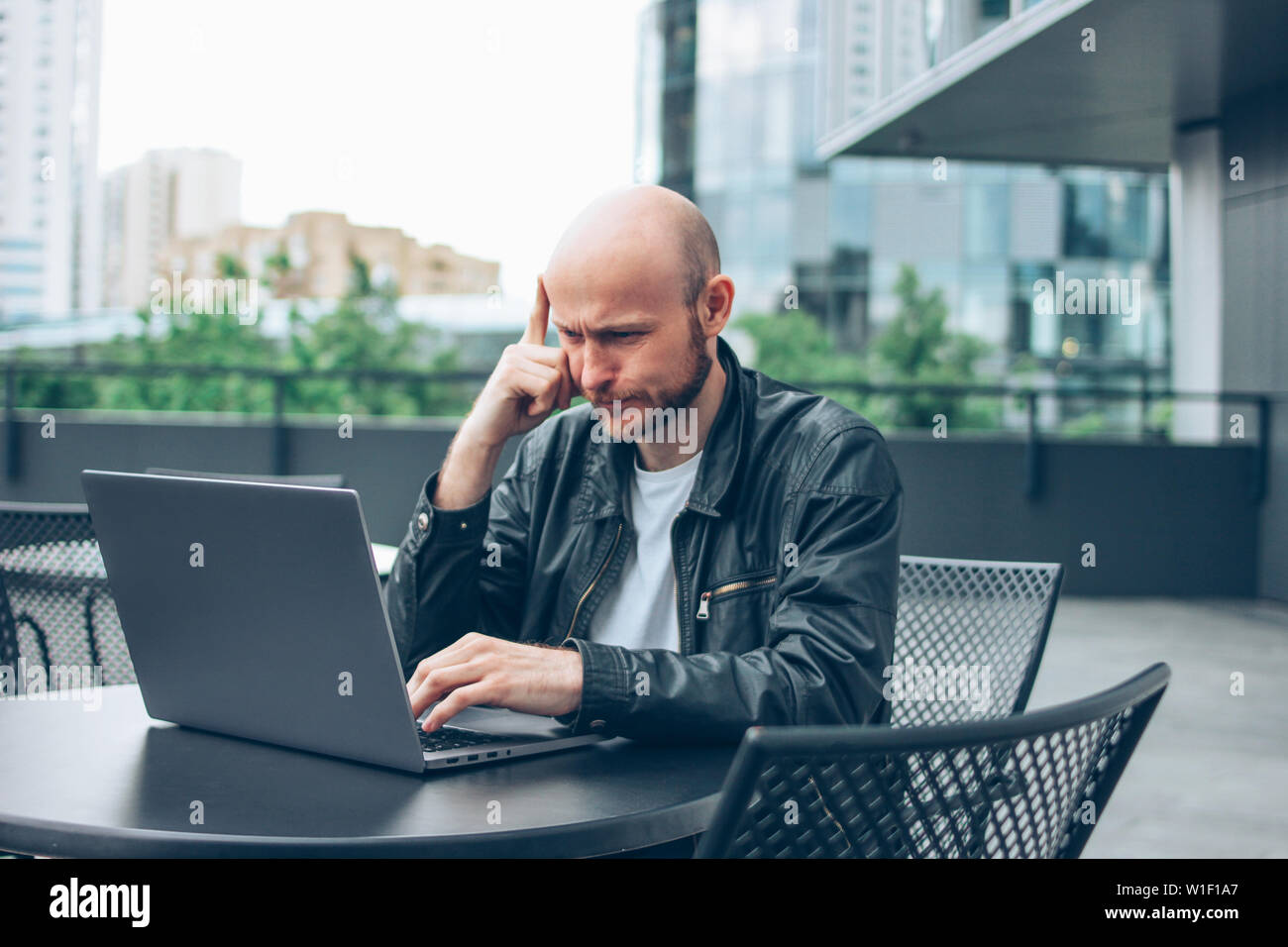 Thinking Attractive Adult Successful Bald Bearded Man In Black Jacket