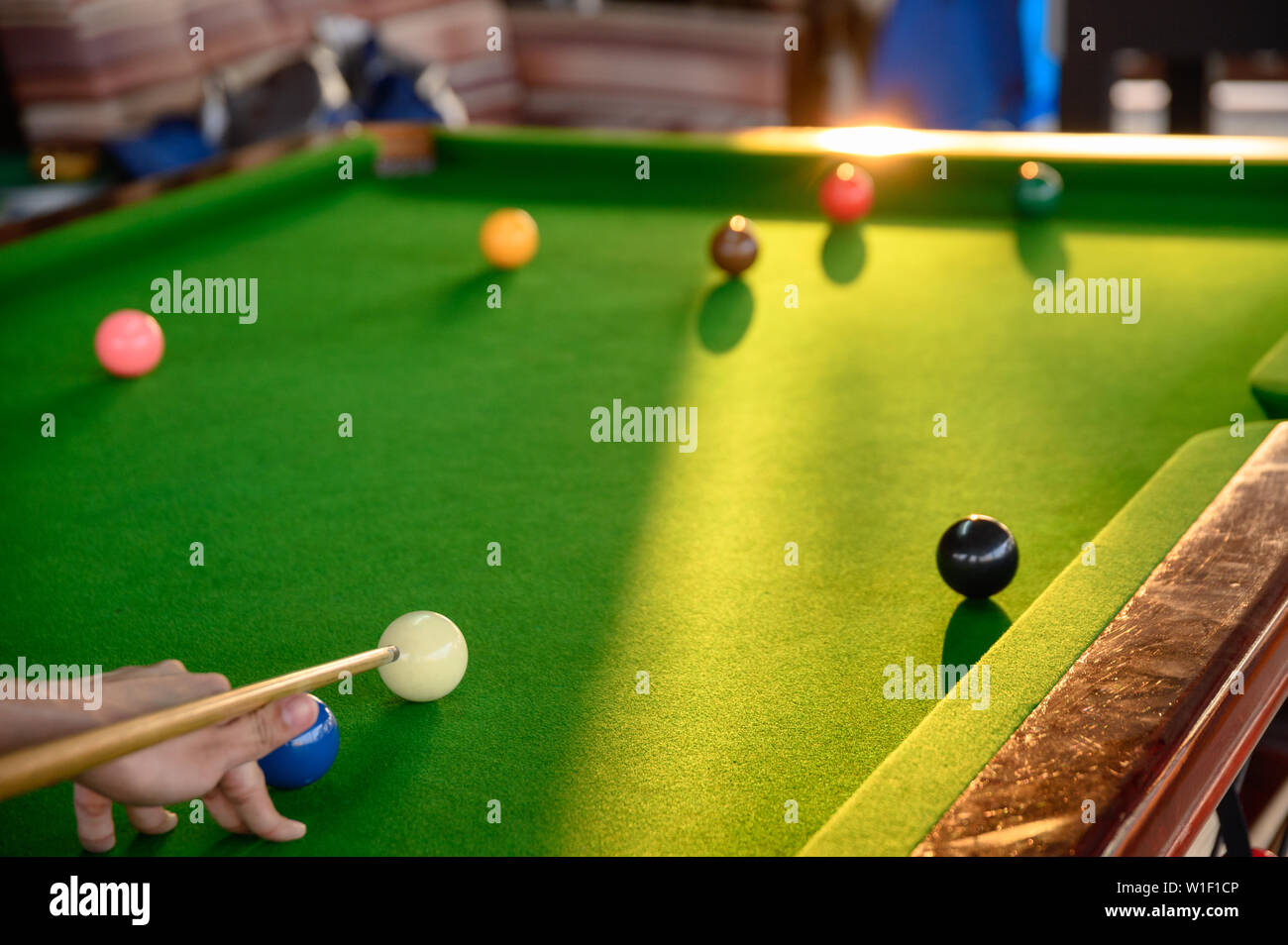 Man's hand playing snooker in bar with color snooker ball Stock Photo ...