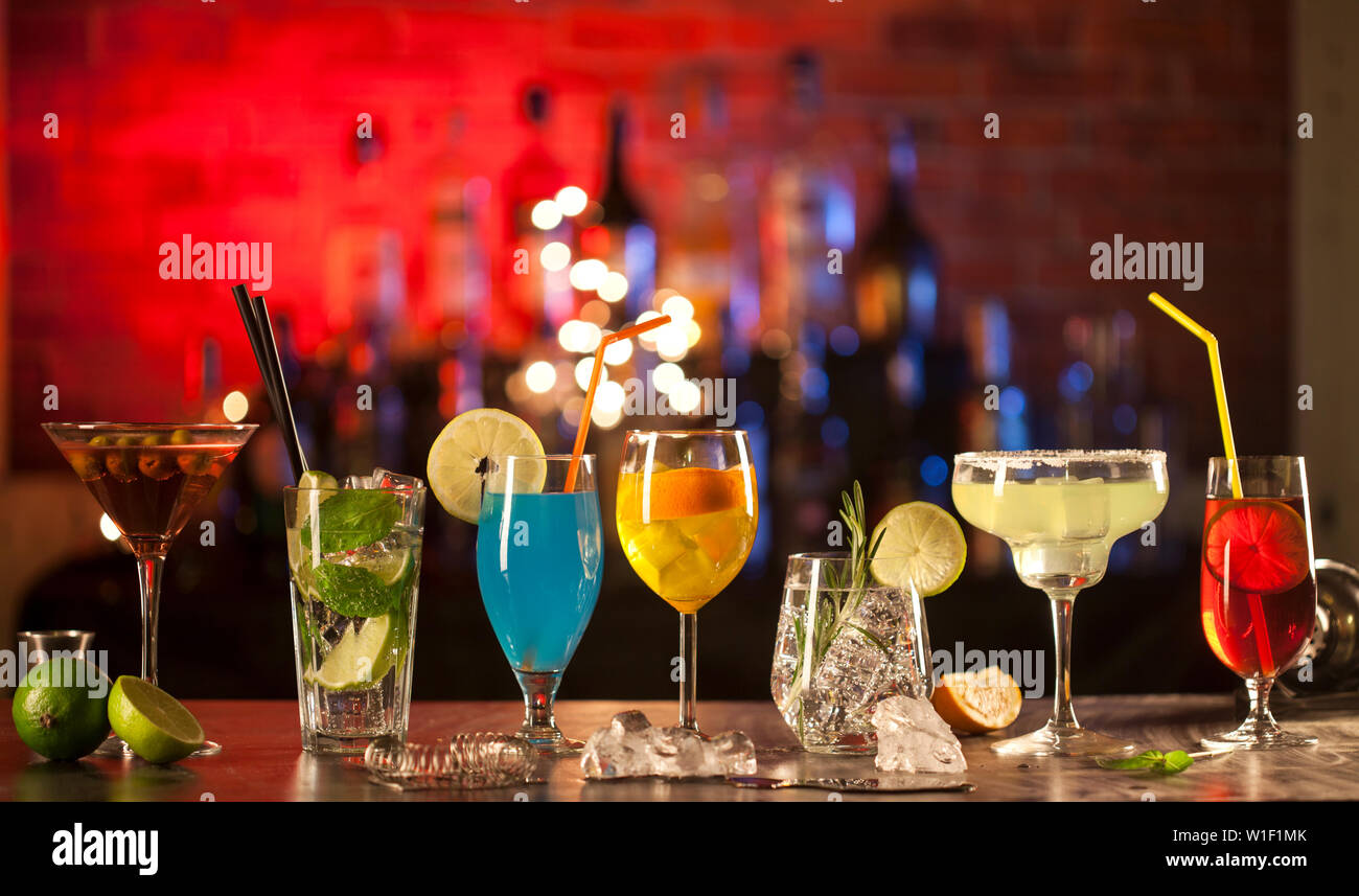 Set with different cocktails on a bar lights background Stock Photo - Alamy