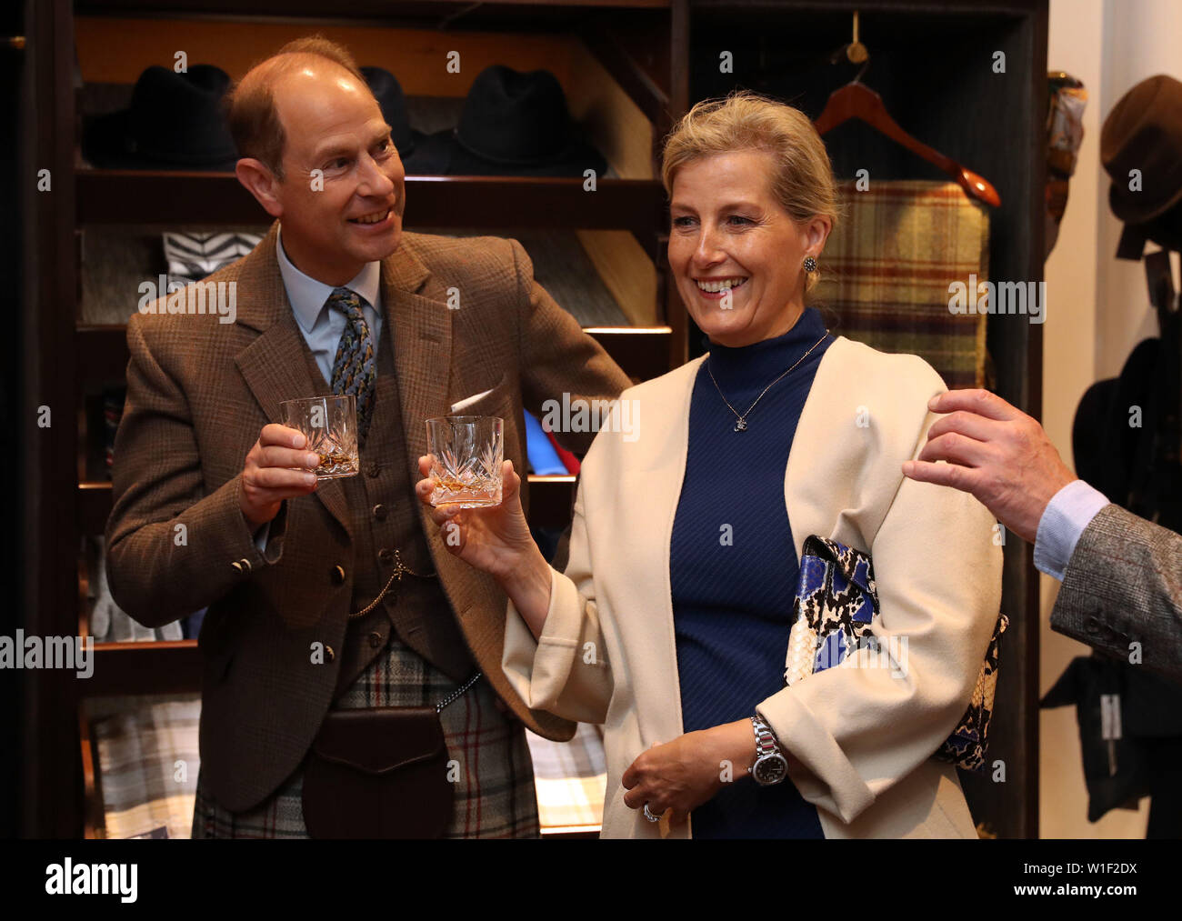 The Earl and Countess of Forfar pour a bottle of whisky ahead of ...