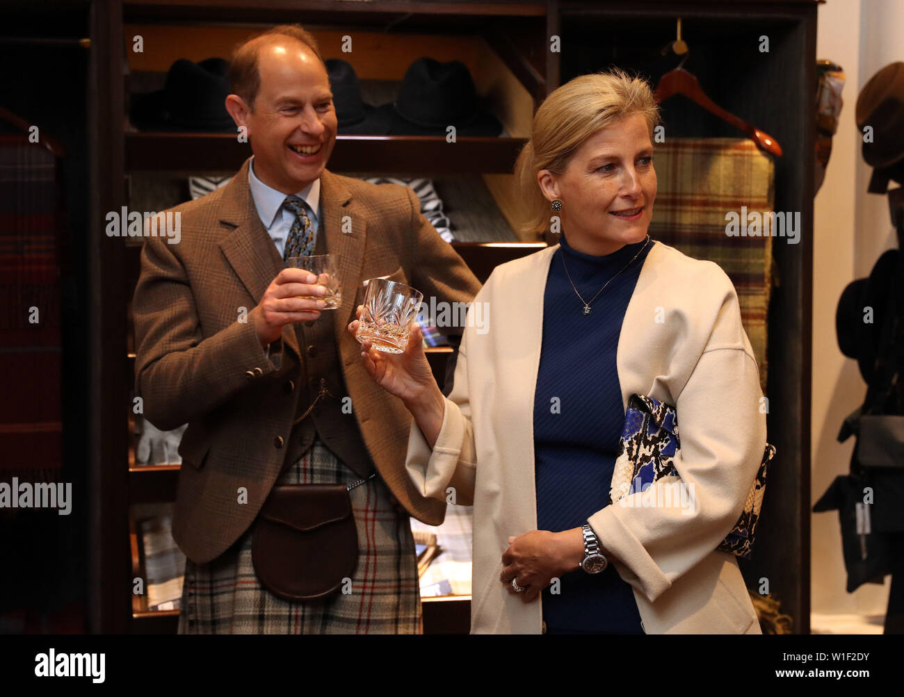 The Earl and Countess of Forfar pour a bottle of whisky ahead of ...