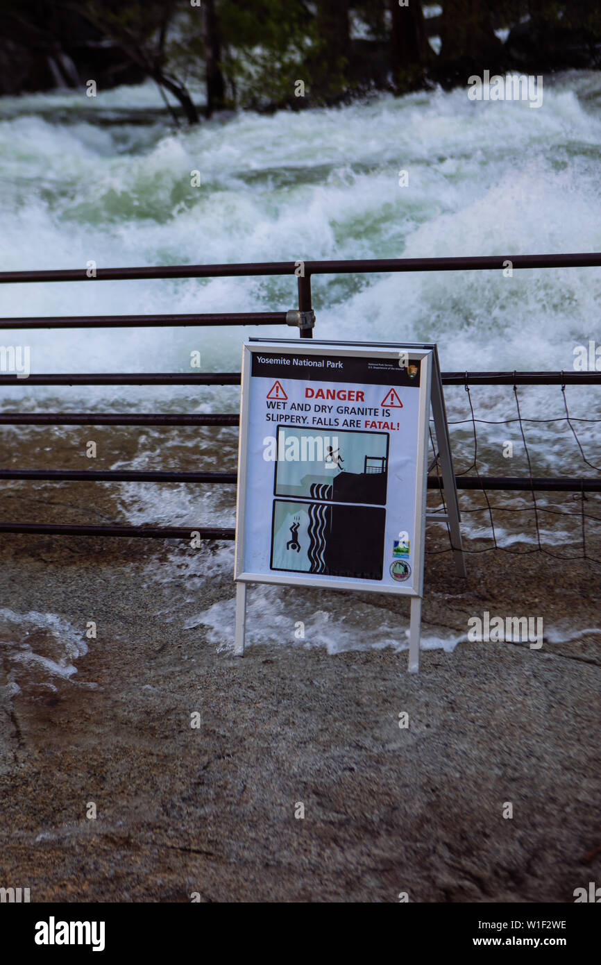 Sign at the border of overflowed Merced River in Vernal Falls, warning ...
