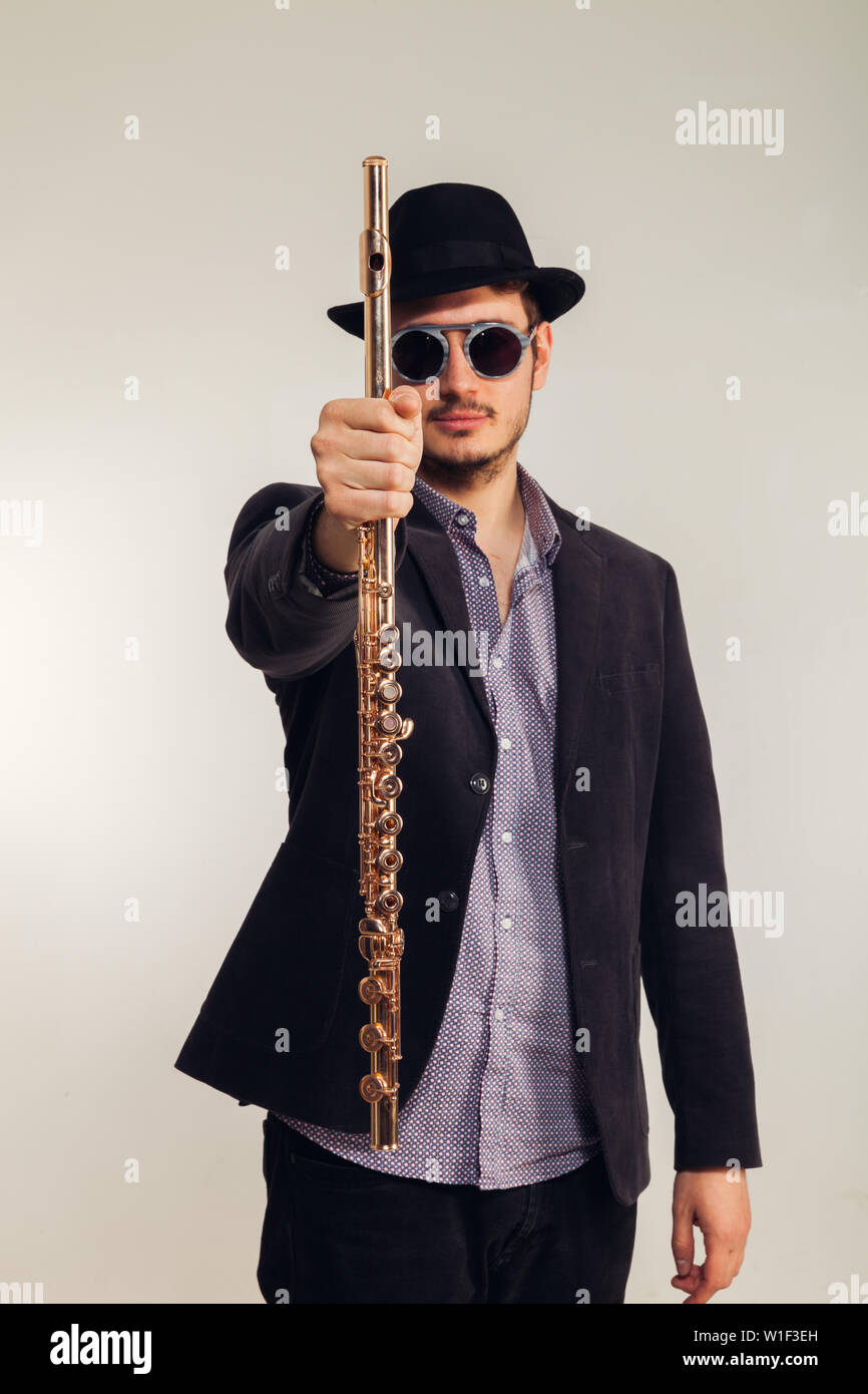 Portrait studio musician with his musical instrument Stock Photo - Alamy