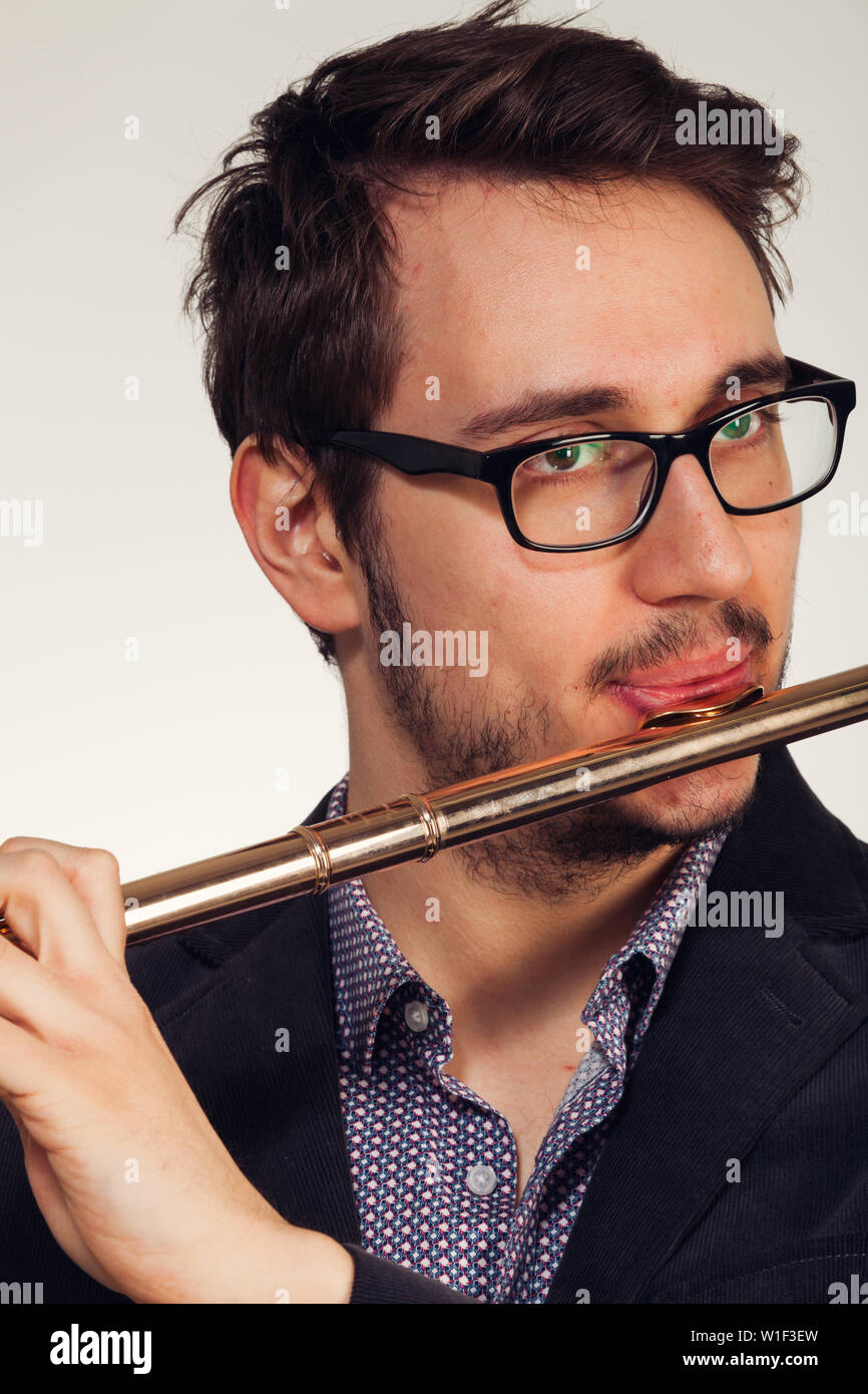 Portrait studio musician with his musical instrument Stock Photo - Alamy