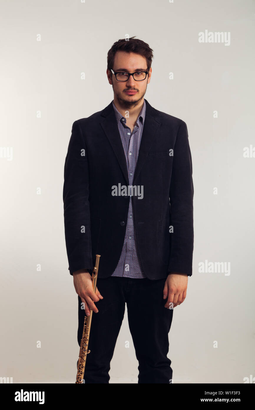 Portrait studio musician with his musical instrument Stock Photo - Alamy