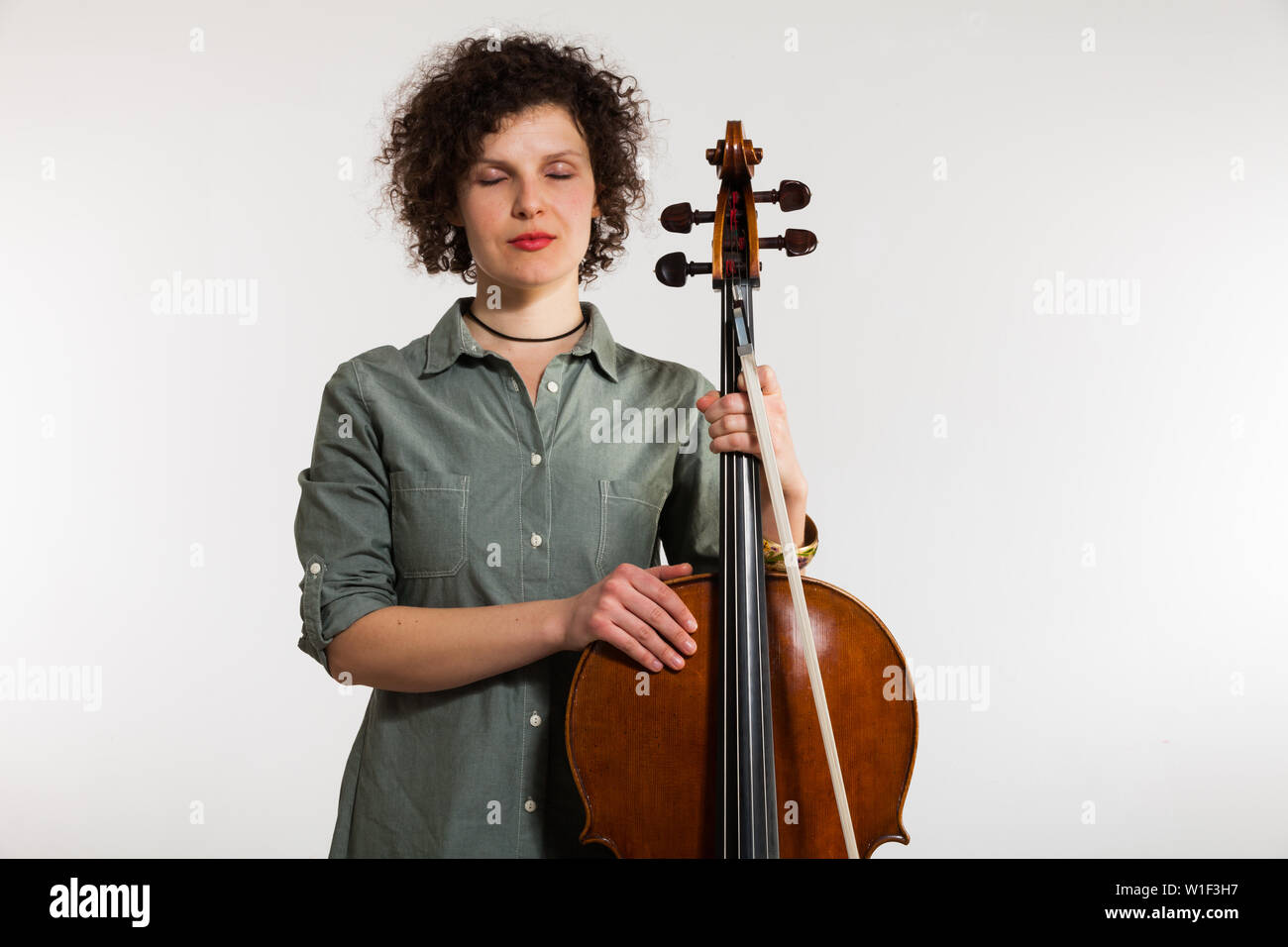 Portrait studio musician with his musical instrument. Year 2017 Stock ...