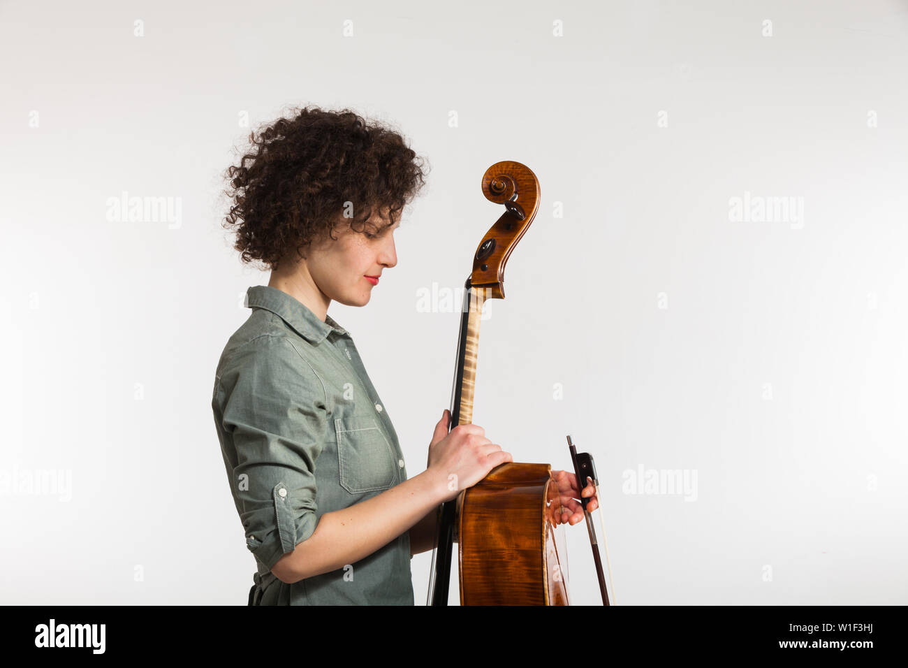 Portrait studio musician with his musical instrument Stock Photo - Alamy