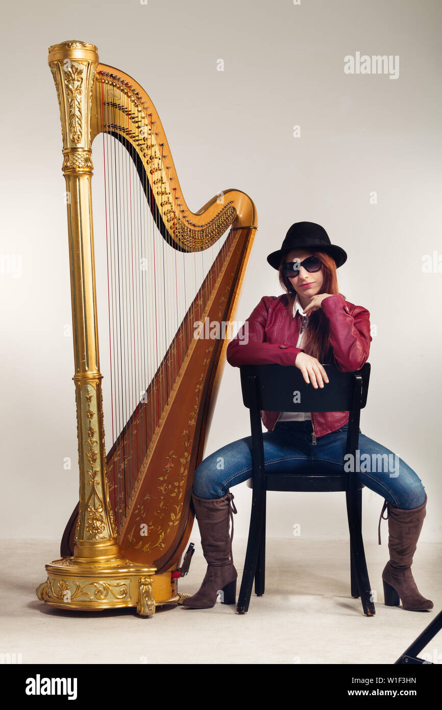 Portrait studio musician with his musical instrument Stock Photo - Alamy