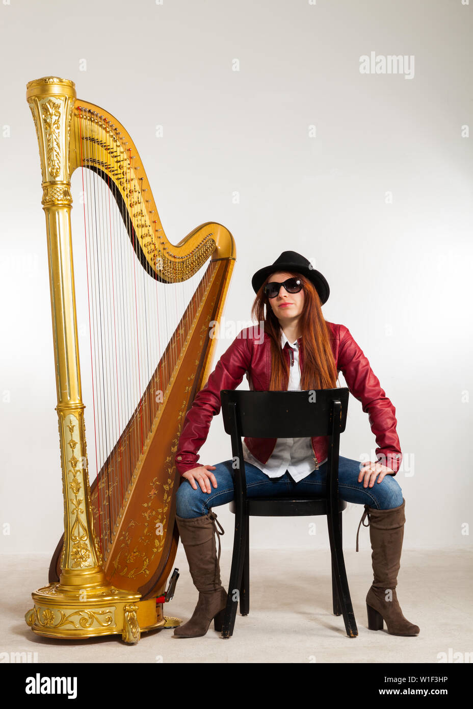 Portrait studio musician with his musical instrument Stock Photo - Alamy