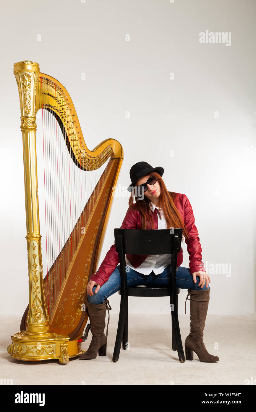Portrait studio musician with his musical instrument Stock Photo - Alamy