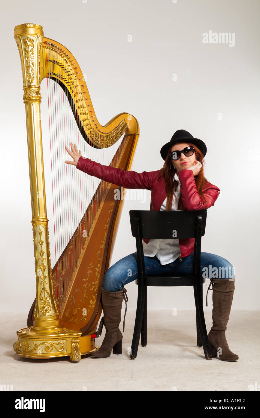 Portrait studio musician with his musical instrument Stock Photo - Alamy