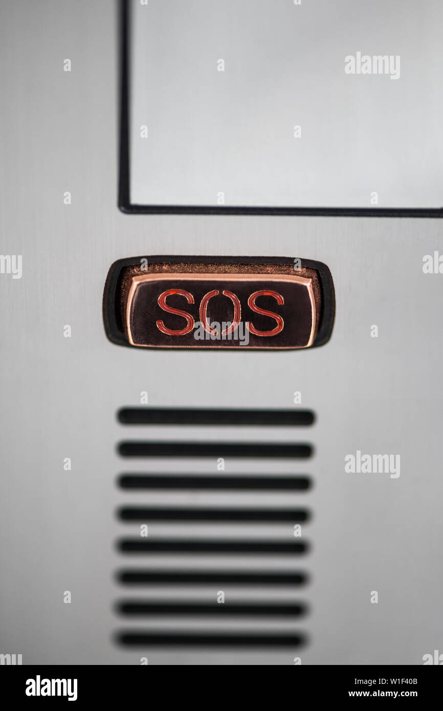 button SOS. SOS button close-up on the device panel, intercom. Help ...