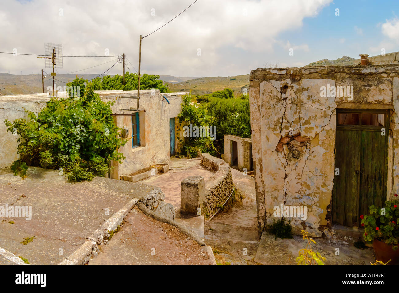 Old abandoned town. Narrow street in old Greek village. Traditional ...