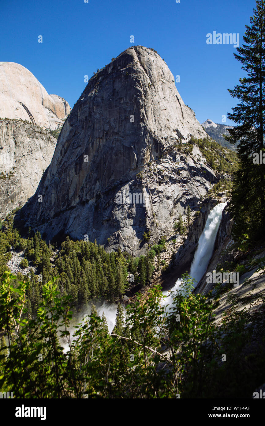 Vertical view of Nevada Fall and Liberty Cap from John Muir Trail with ...